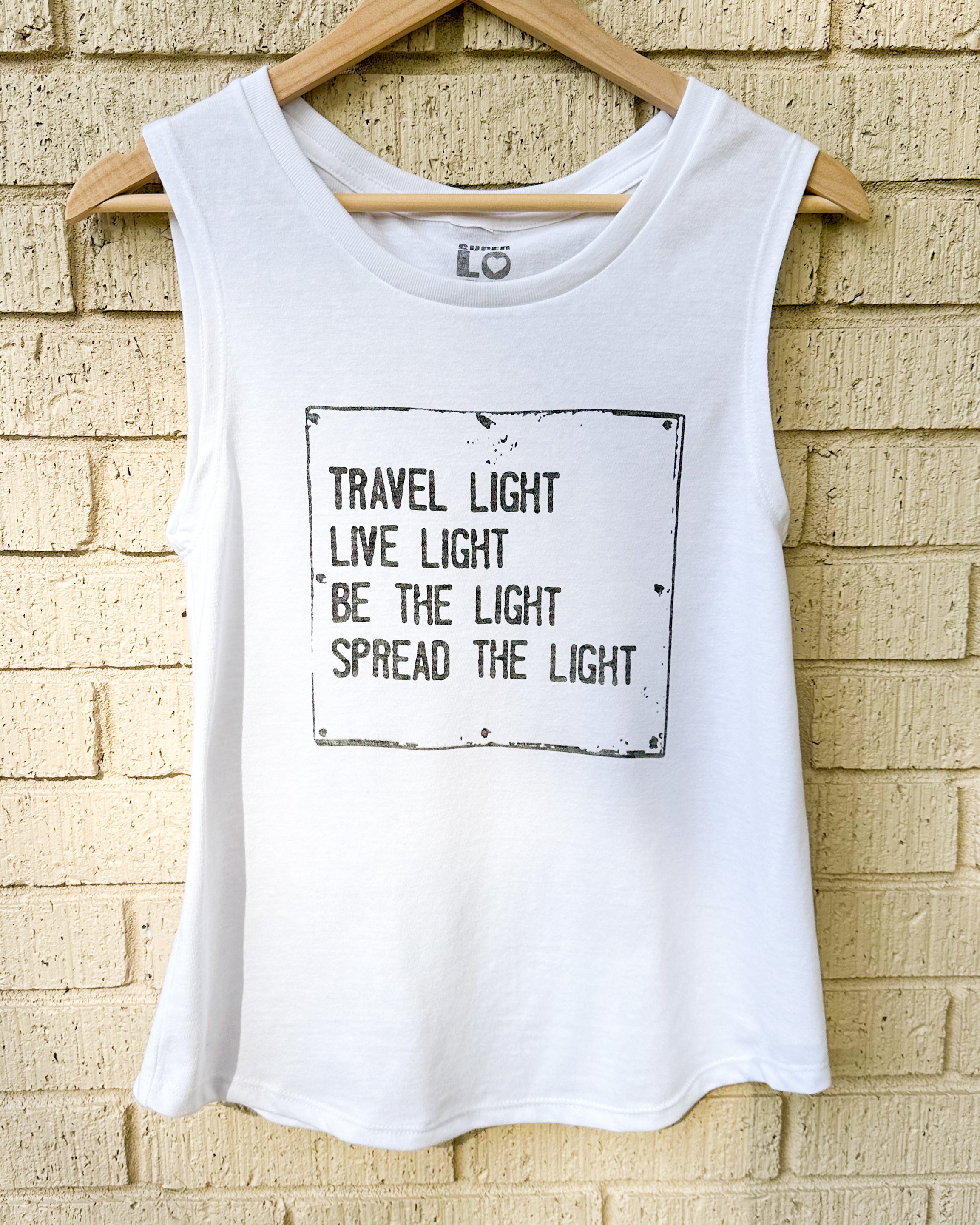 TRAVEL LIGHT - White Muscle Tee – SuperLoveTees | Graphic Tees Inspired ...